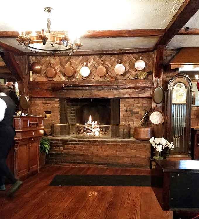 A massive colonial fireplace with copper pots hanging proudly above. This hearth has been the heart of the inn for centuries.