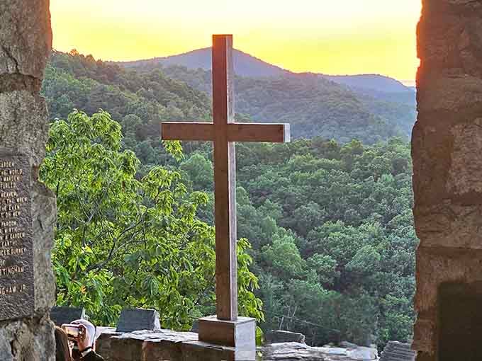 That wooden cross framed by mountains and golden light is the kind of image that stays with you for years.