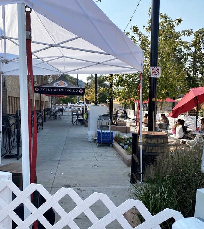 White fences, Avery Brewing Co. signage, and open air. The Sink's patio is Boulder's best-kept outdoor secret.