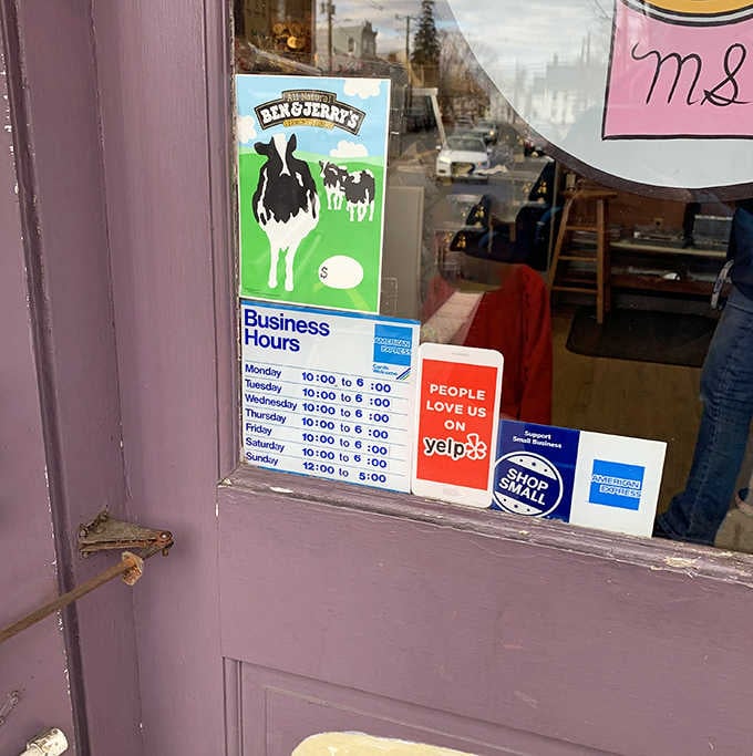 Business hours posted clearly because knowing when to get your chocolate fix is crucial information.