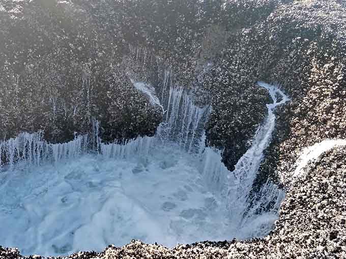 Sea foam decorates the edges like nature's own whipped cream topping on this geological dessert.