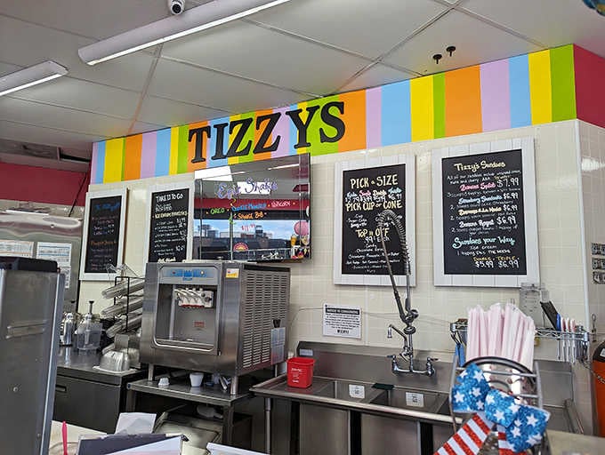 Behind this counter, the magic happens. Rainbow stripes, chalkboard menus, and a soft serve machine ready for action.