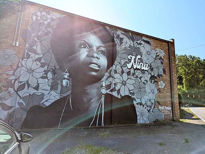 Nina Simone's mural watches over Tryon with flowers and fire, a portrait as powerful as her music.