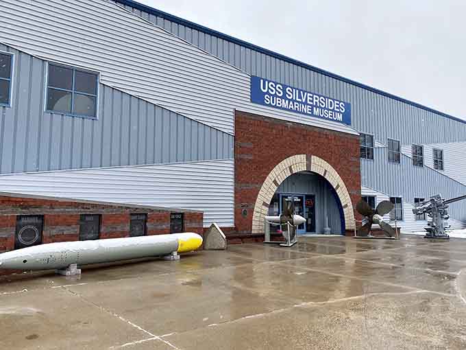 Torpedoes out front, a propeller by the door, and a bold blue sign: this entrance sets the tone immediately and perfectly.