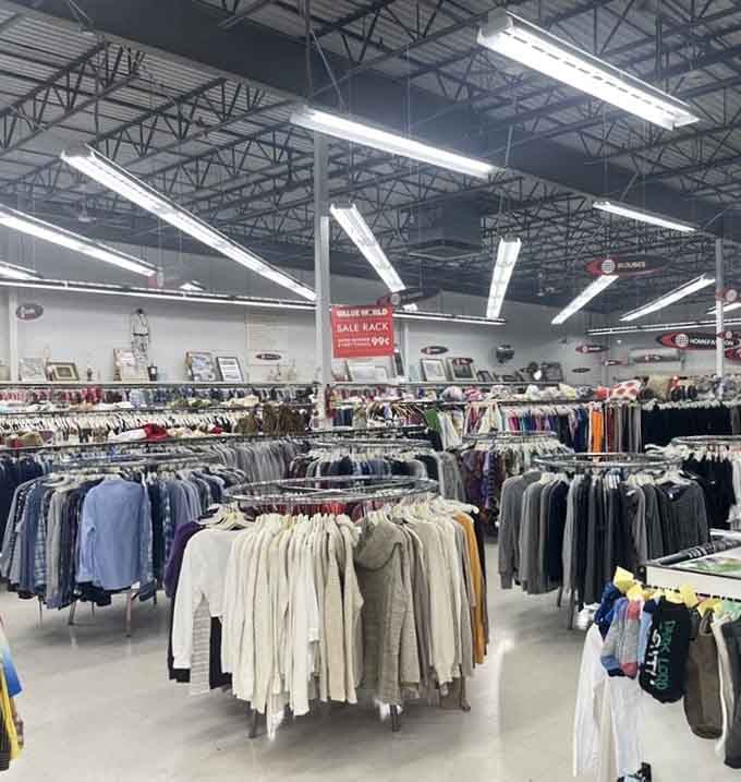 Circular sale racks packed tight with sweaters and tops, a thrifter's workout disguised as a shopping trip.