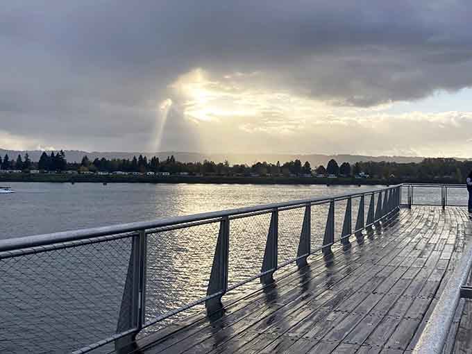 Rain-soaked boards, dramatic clouds, and a single ray of light breaking through. The waterfront doesn't take bad days off.