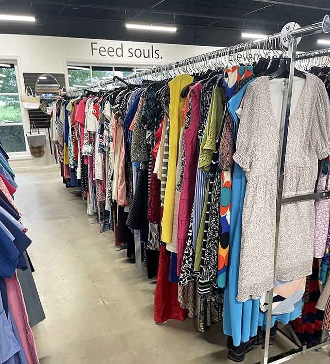 Women's clothing hanging under inspirational signage, where "Feed souls" meets fabulous fashion finds at unbeatable prices every day.