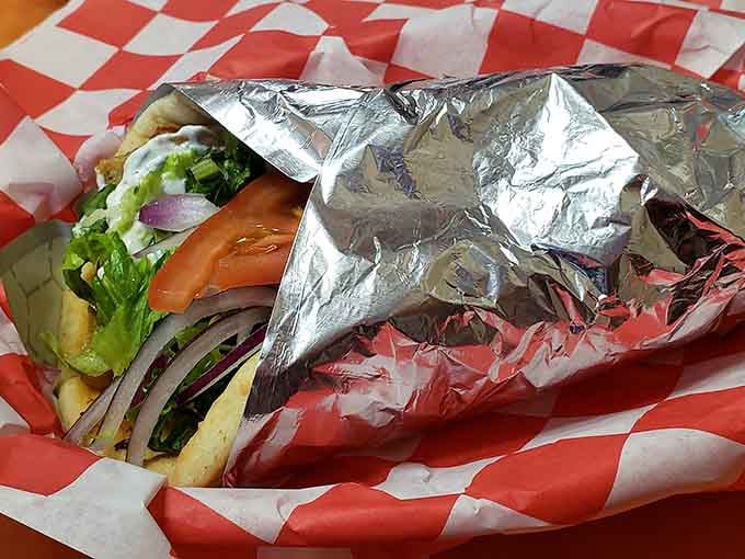 Wrapped tight in foil, this chicken gyro is packed with fresh vegetables and ready to deliver pure satisfaction.