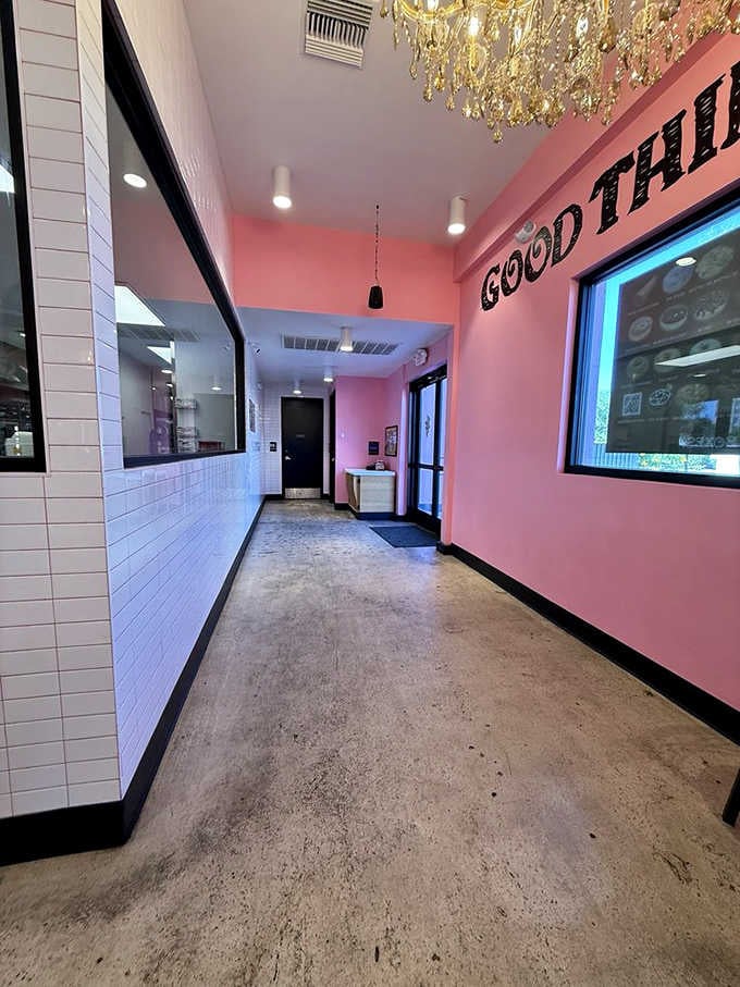 Pink walls, polished concrete floors, and bold lettering remind you good things happen here daily.