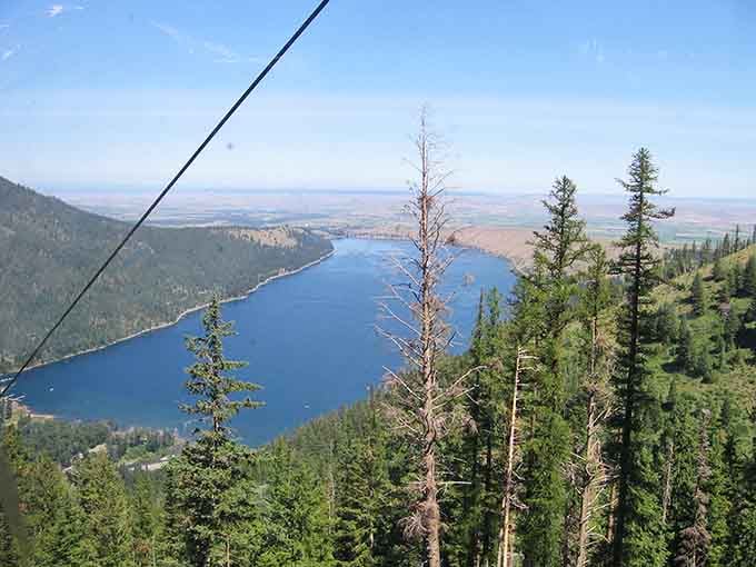 From up here, the lake looks like someone dropped a sapphire into a mountain valley and forgot to pick it up.