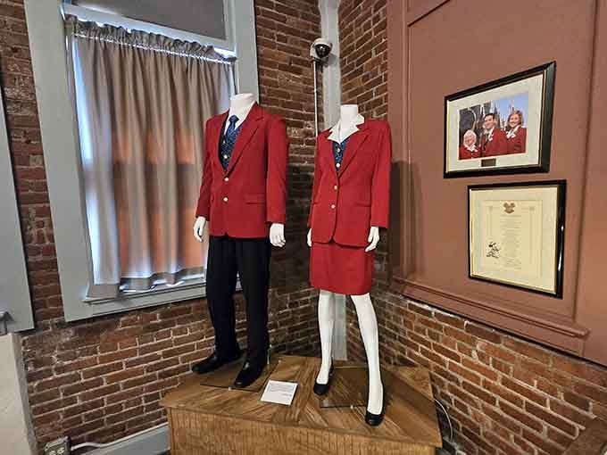 These sharp red uniforms once belonged to real Disney cast members, proof that even the wardrobe tells a story here.