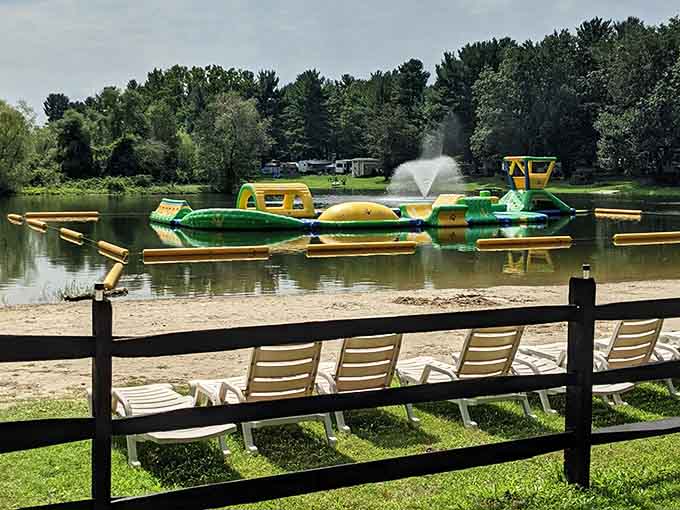 Lounge chairs, a sandy shore, and an inflatable water park floating on the lake. Summer has officially reported for duty.