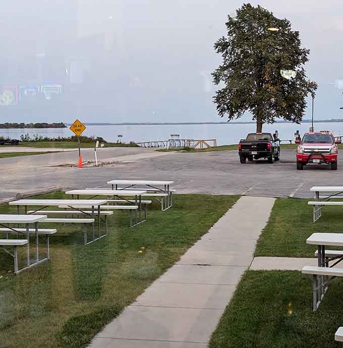 Picnic tables facing Lake Winnebago, where the view is free and the perch is absolutely worth the drive.