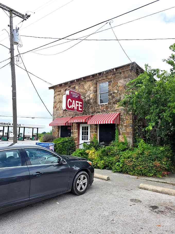 The stone building sits right on the corner like it's been feeding hungry people since the beginning of time itself.