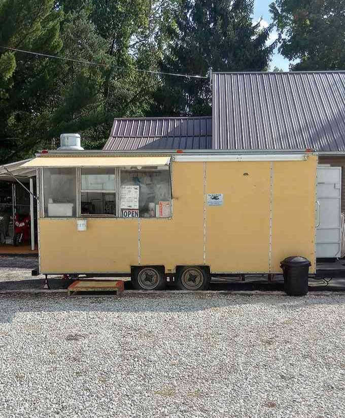 The Bull Truck food trailer, sitting in gravel and meaning business, proof that the best meals come in humble packages.