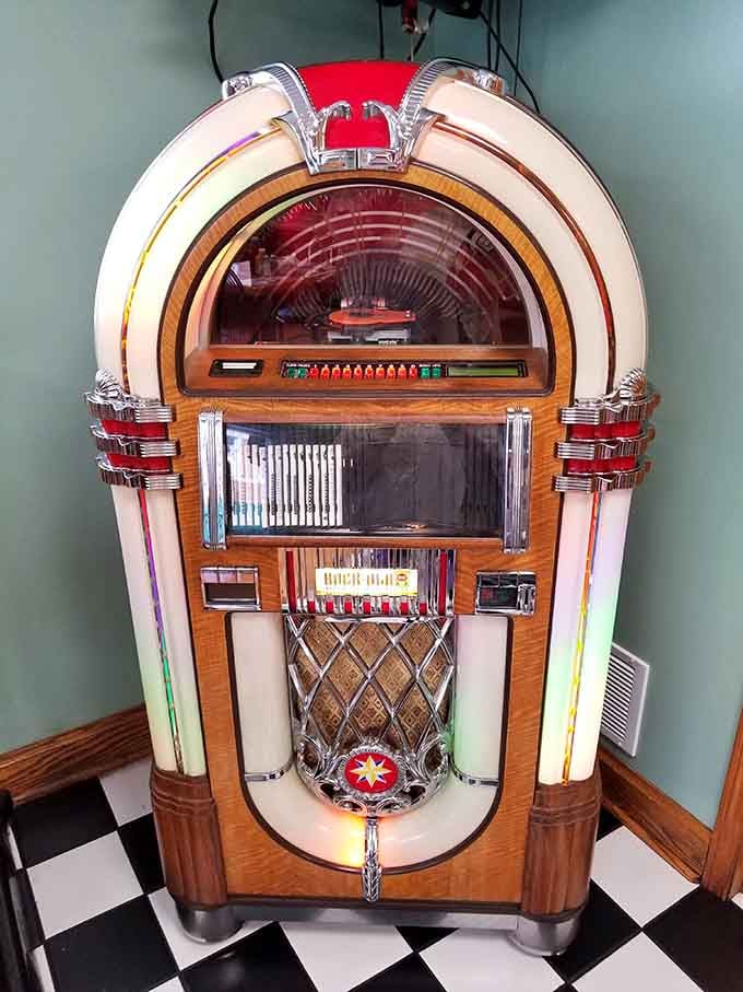 A classic jukebox glowing in the corner, because great food deserves an equally great soundtrack.