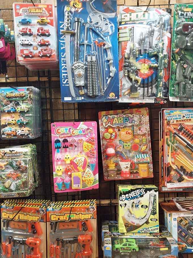 A wall of colorful toys for every kid, from ninja sets to dinosaurs, all in one cheerful spot.