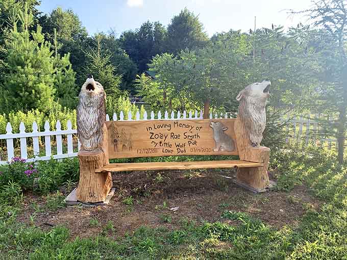 A beautifully carved memorial bench sits quietly on the grounds, reminding you that love takes many forms.