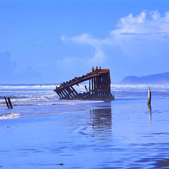 The Milky Way arches over the Peter Iredale like the universe itself stopped to pay its respects.