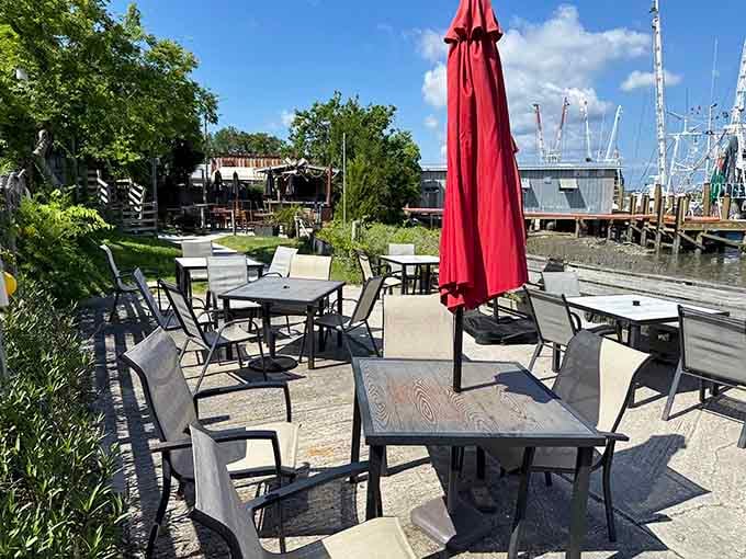 Outdoor tables right on Shem Creek, with shrimp boats visible in the distance, this is the view that earns its keep.