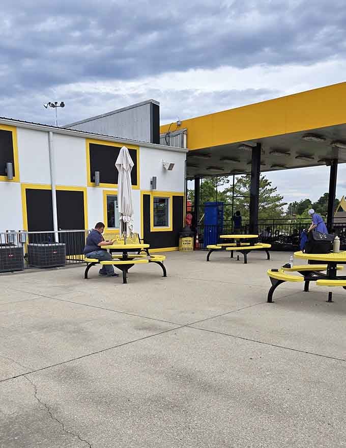 The yellow picnic tables are where you sit, catch your breath, and quietly plan your comeback lap strategy.