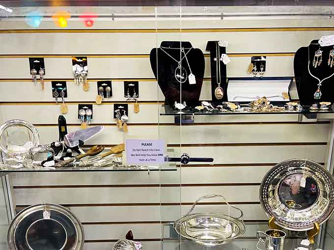 Sterling silver dishes, pendant necklaces, and dangling earrings lined up like they're auditioning for a spot in your jewelry box.