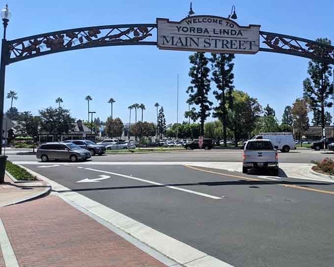 The Main Street arch frames a street that feels like it belongs in a different, calmer era. The good news is, it's real and it's here.