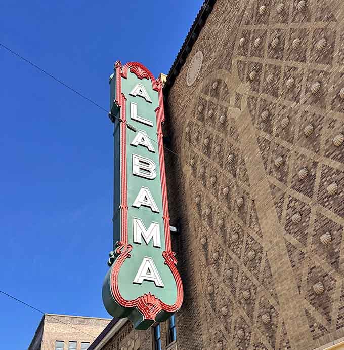 That bold vertical sign rising against a blue Alabama sky is basically the building's way of saying, "Yes, we're worth it."