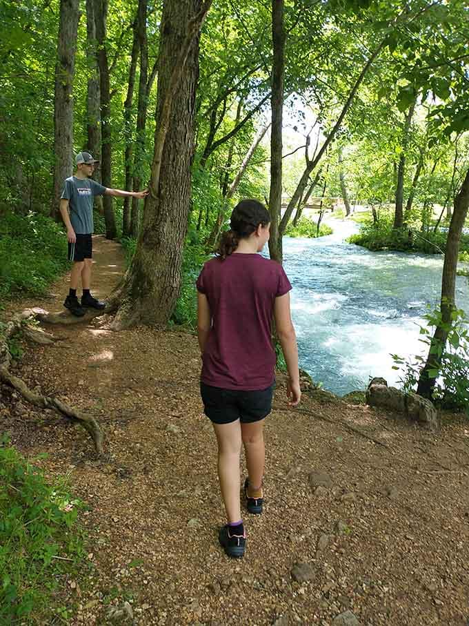 Two visitors discovering the spring run trail, which is exactly the right reaction to water this beautiful.