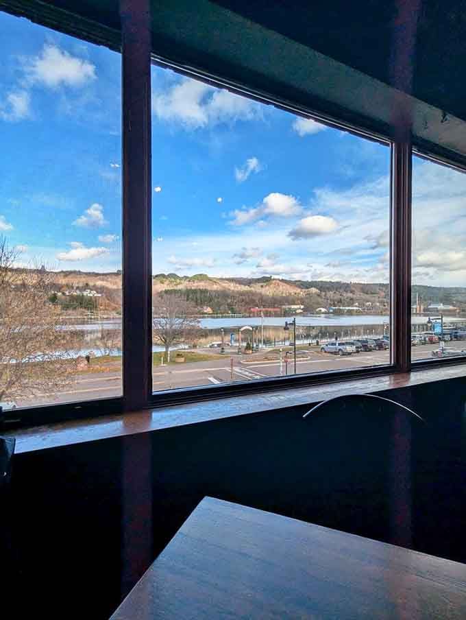 Windows framing Portage Lake views that remind you why people brave Upper Peninsula winters for this kind of beauty.