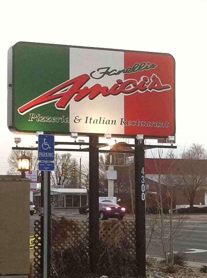 The road sign says Fanelli's Amici's Pizzeria and Italian Restaurant, draped in Italian flag colors. You're in the right place.
