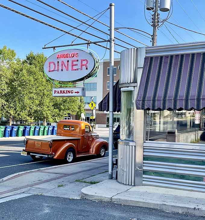 That vintage copper truck parked outside Angelo's looks like it drove straight out of 1948 and decided to stay for breakfast.