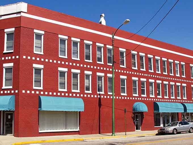 Three stories of rich red brick and crisp white trim make this Anniston building genuinely hard to ignore.