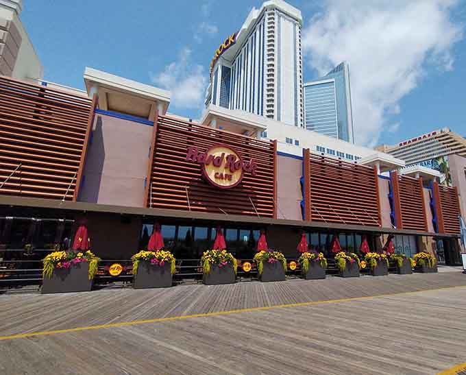 Hard Rock Cafe sits right on the boardwalk, flower boxes and all, looking far too cheerful to ignore.