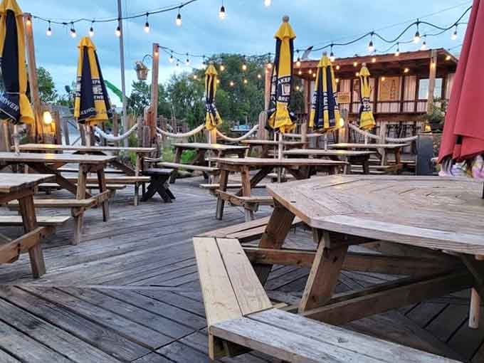 Picnic tables, string lights, and open sky overhead, outdoor dining doesn't get more honest than this.