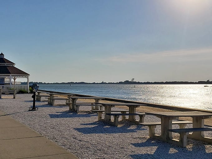 Picnic tables line the bay shore beside the gazebo, offering front-row seats to sunsets that will make you seriously reconsider your evening plans.