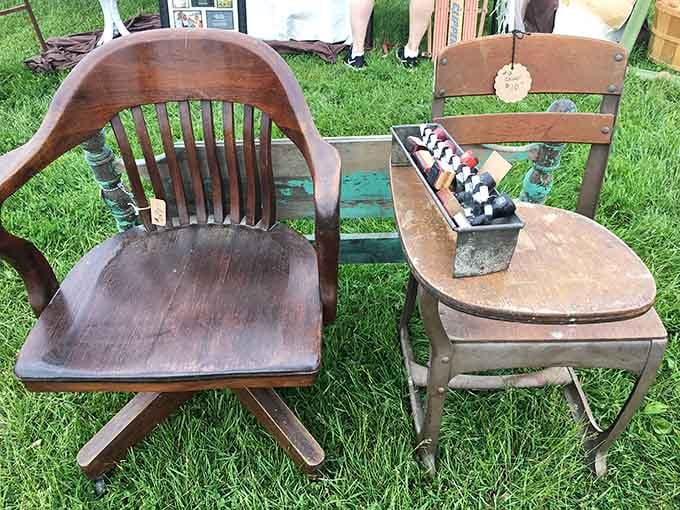 Solid wooden chairs sitting in the grass, quietly waiting for someone to recognize a genuinely good thing.