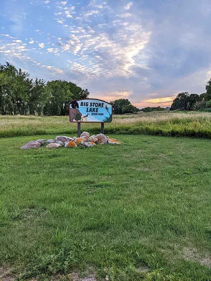 The park sign sits surrounded by granite rocks and prairie grass, looking completely at home in the best possible way.