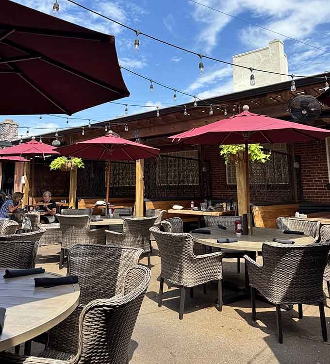 String lights, burgundy umbrellas, and wicker chairs under an open sky, the patio at Billy G's is where afternoons go to become evenings.