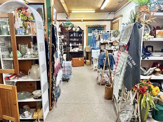 A long aisle lined with woven textiles, glassware, and wooden furniture, the kind of path you walk slowly and leave happy.