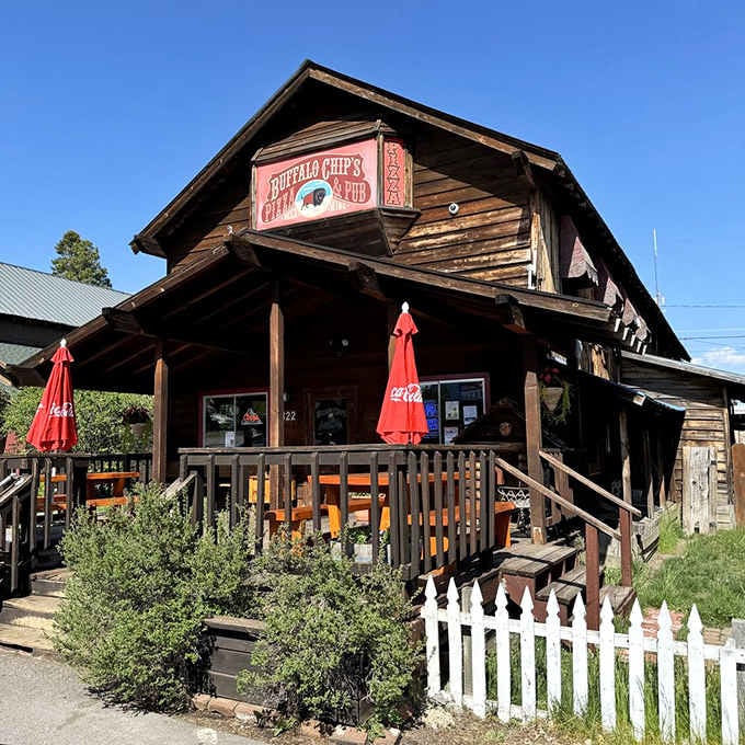 Red umbrellas, a white picket fence, and blue skies above. This place looks exactly as good as it tastes.