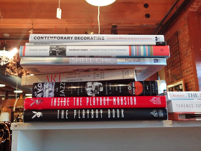 A stack of books that covers jazz, art, decorating, and the Playboy Mansion. Canal Street contains multitudes.