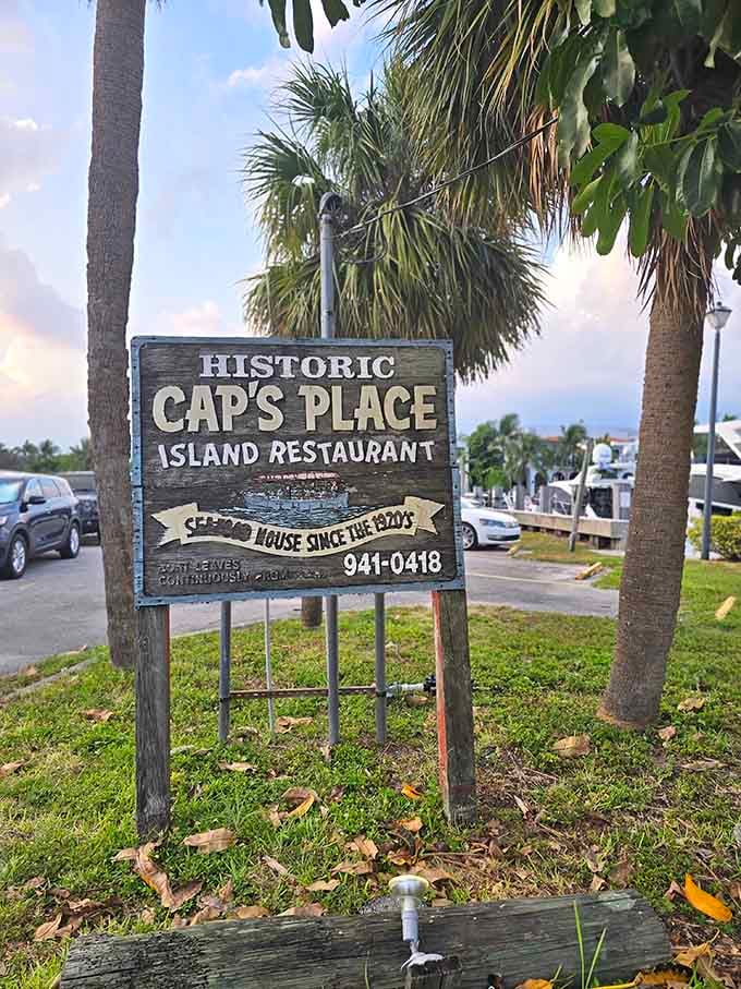 A wooden sign that says it all, historic, proud, and pointing you toward one of Florida's most memorable meals.