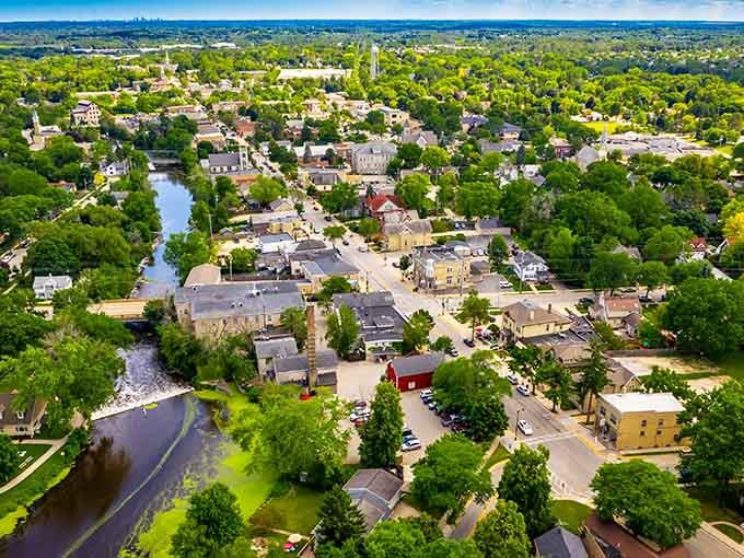 Aerial views reveal how Cedar Creek weaves through town, connecting green spaces and historic buildings in perfect small-town harmony.
