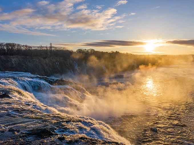 Sunset at the falls turns the mist into gold, because apparently regular beauty wasn't quite enough.