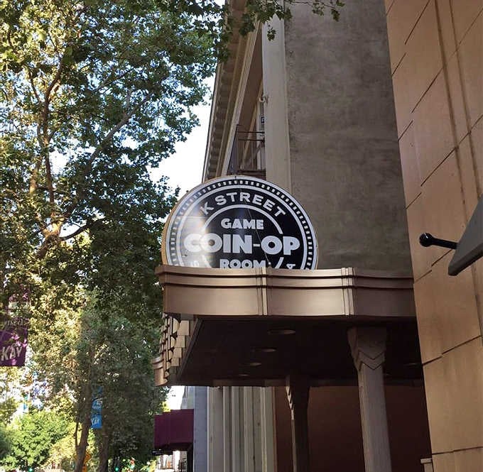 That K Street Coin-Op Game Room sign on the building is your official invitation to stop walking and go inside.