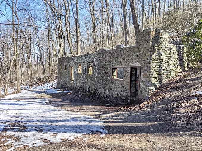 Snow dusts the ground around the ruins, giving the whole scene a quiet, almost reverent stillness.