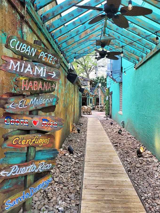 Colorful directional signs pointing to tropical destinations you can't actually reach but can definitely taste here.