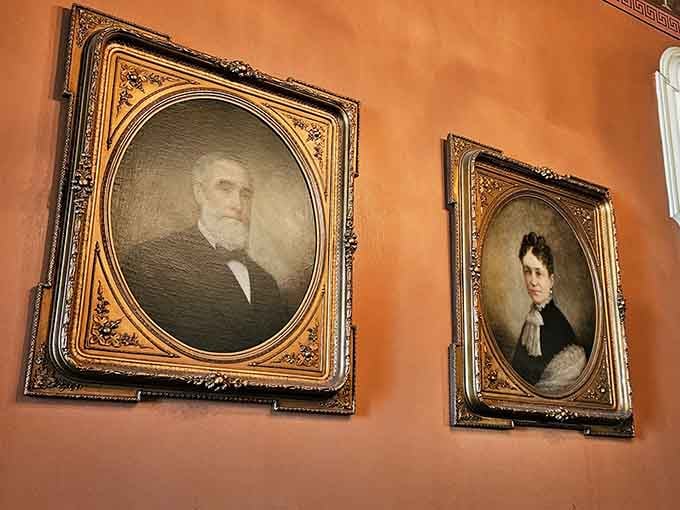These portraits have watched over this hallway for generations. They've seen things. Probably quite a few things.