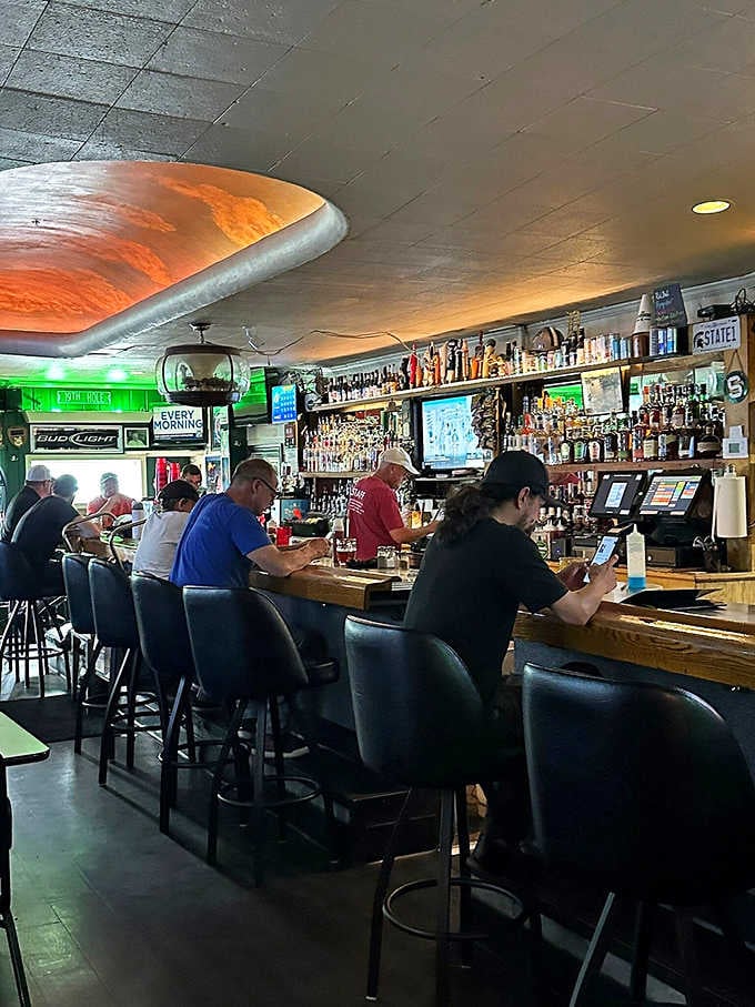 A full bar lined with regulars and stocked shelves that mean serious business. This is exactly what a neighborhood tavern should look like.